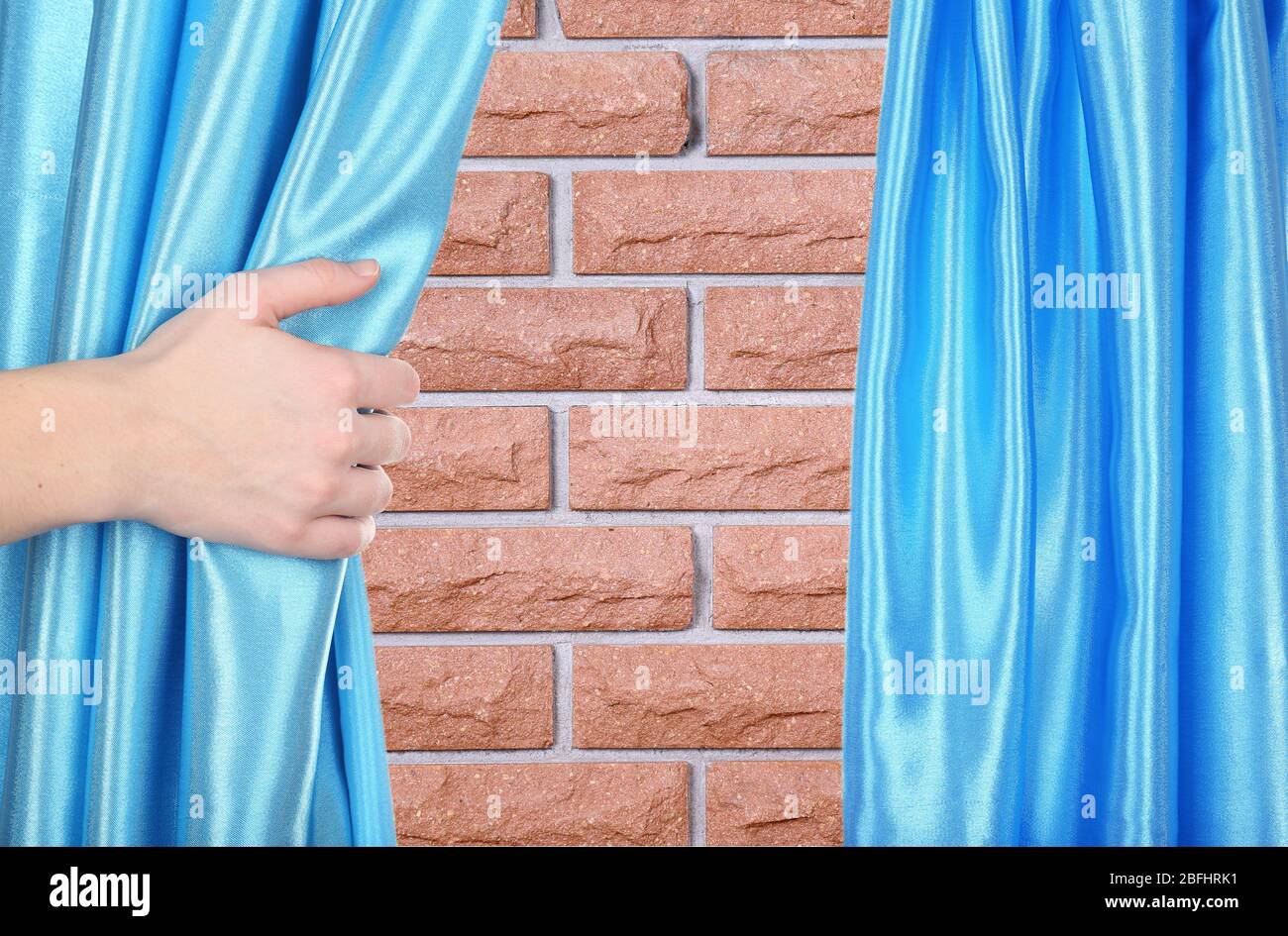 Hand opening red curtain on hi-res stock photography and images - Alamy