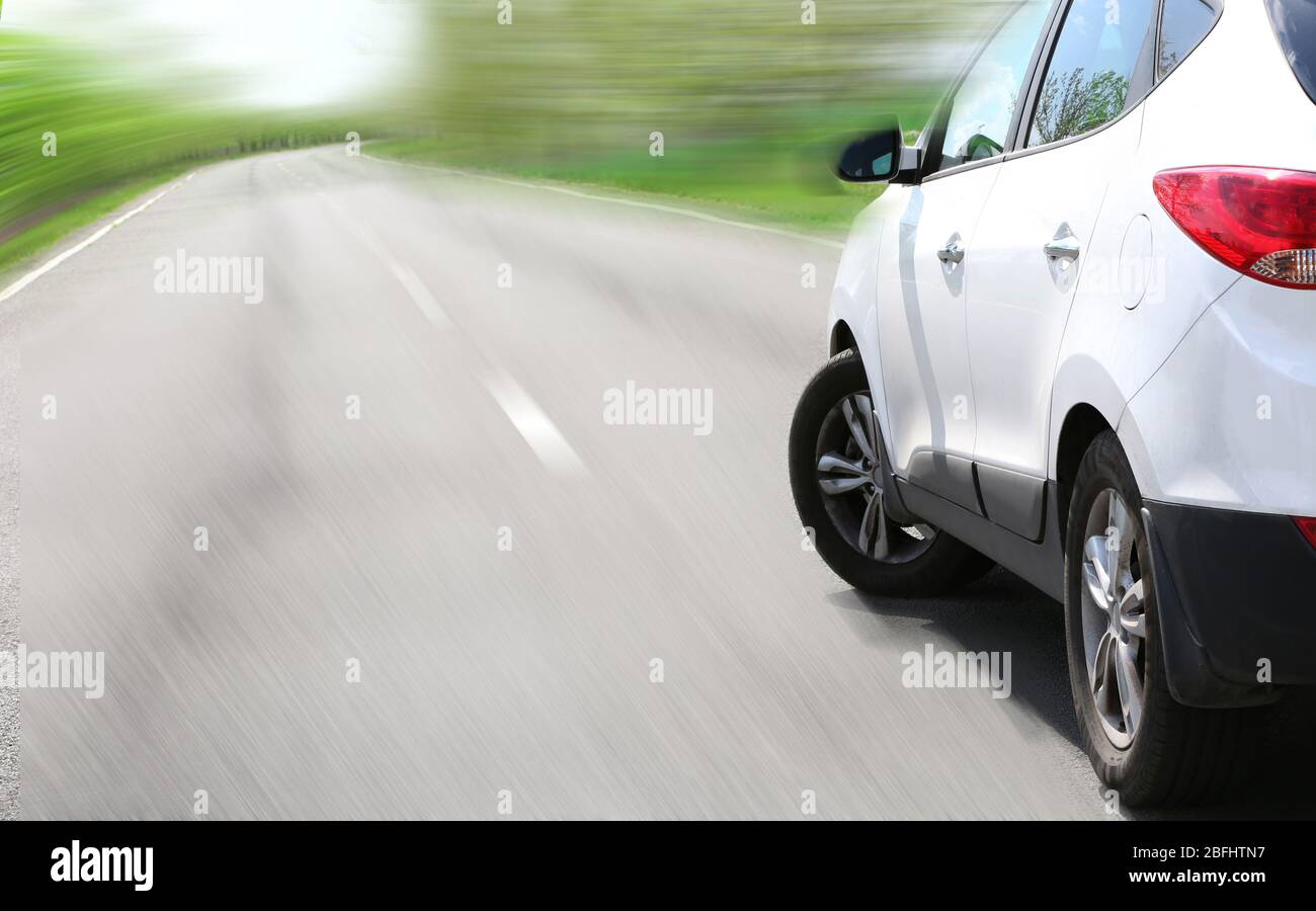 Very fast driving car on road Stock Photo - Alamy