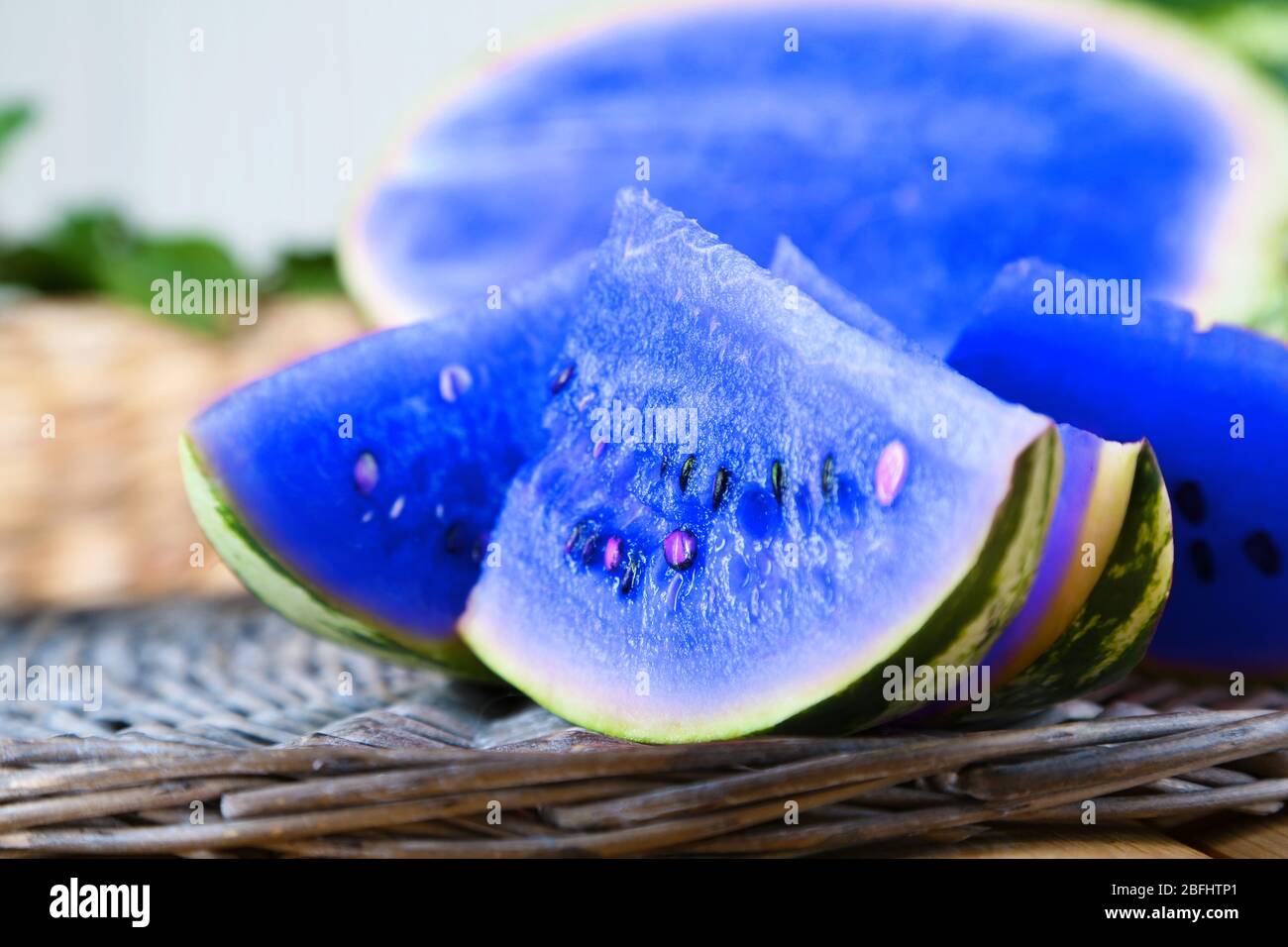 Blue watermelons on wicker tray Stock Photo - Alamy