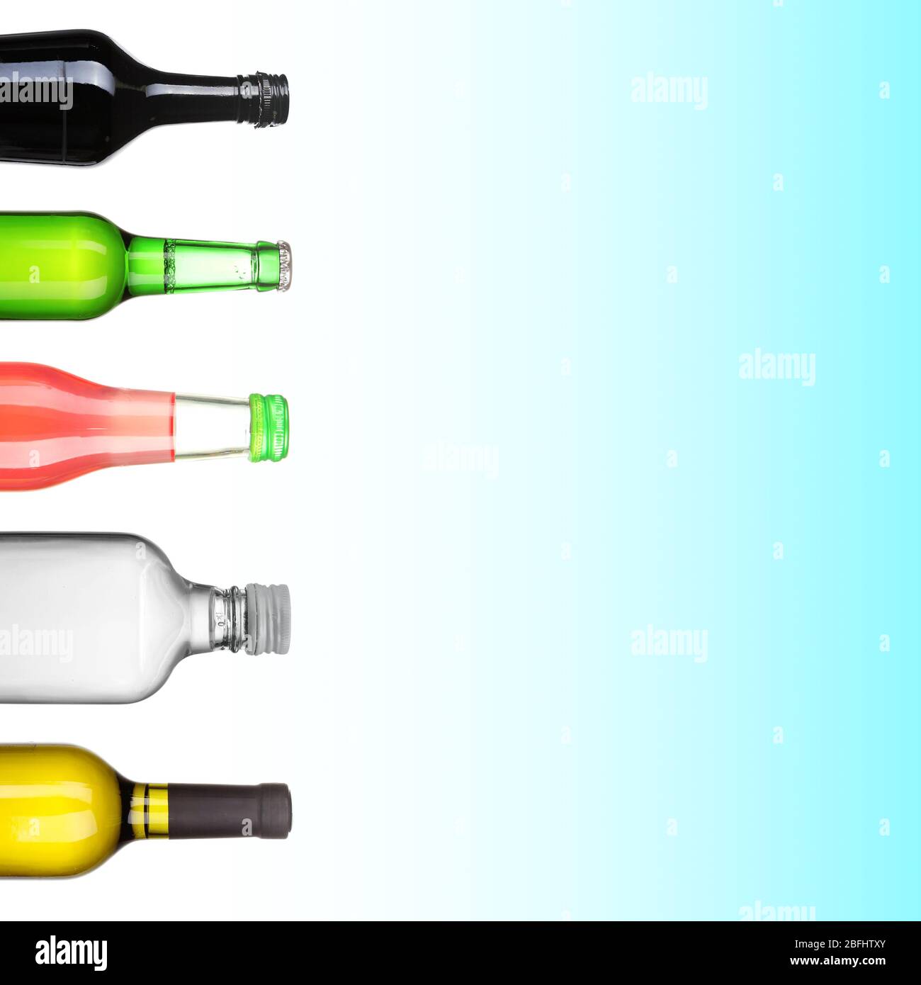 Collage of different alcohol bottles on blue background Stock Photo - Alamy
