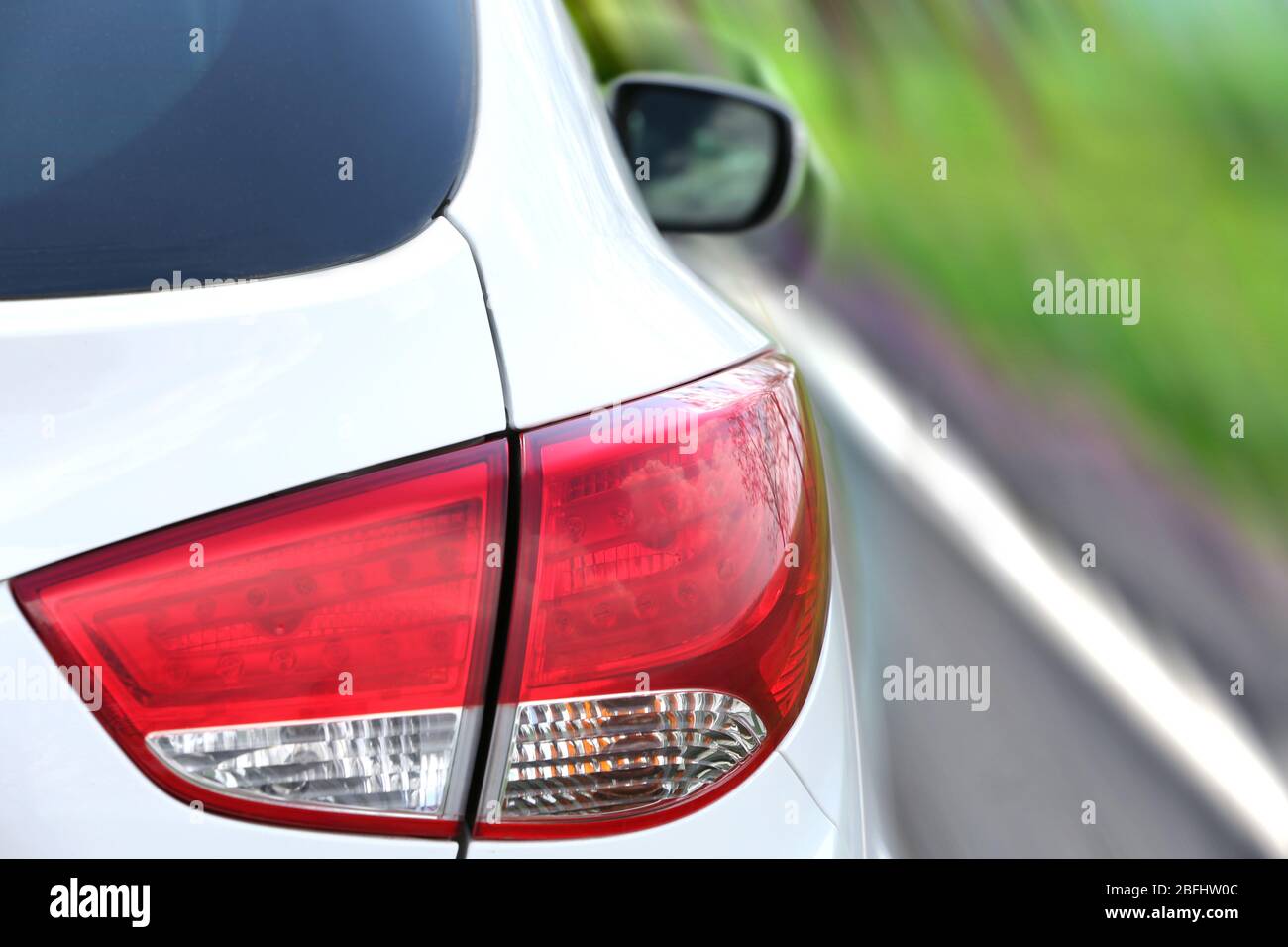 Very fast driving car on road Stock Photo - Alamy