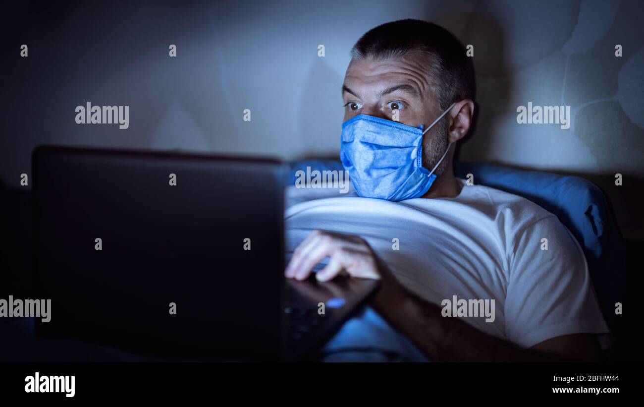 Man computer night bed hi-res stock photography and images - Alamy