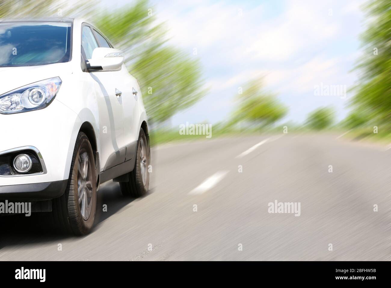 Very fast driving car on road Stock Photo - Alamy