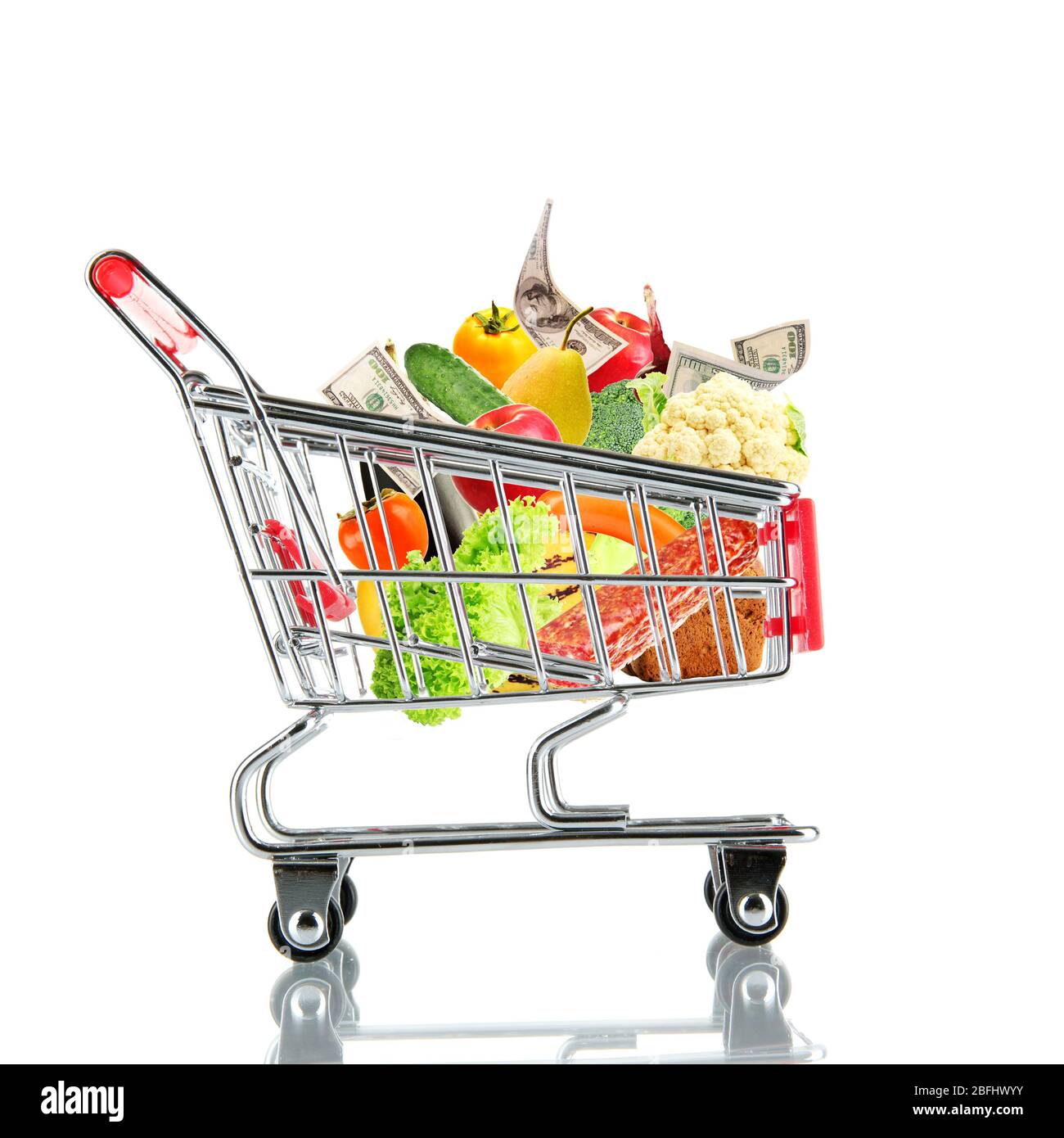 Full shopping trolley, isolated on white Stock Photo - Alamy