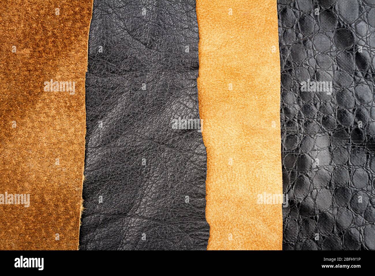 Brown and black leather and artificial alligator skin textures ...