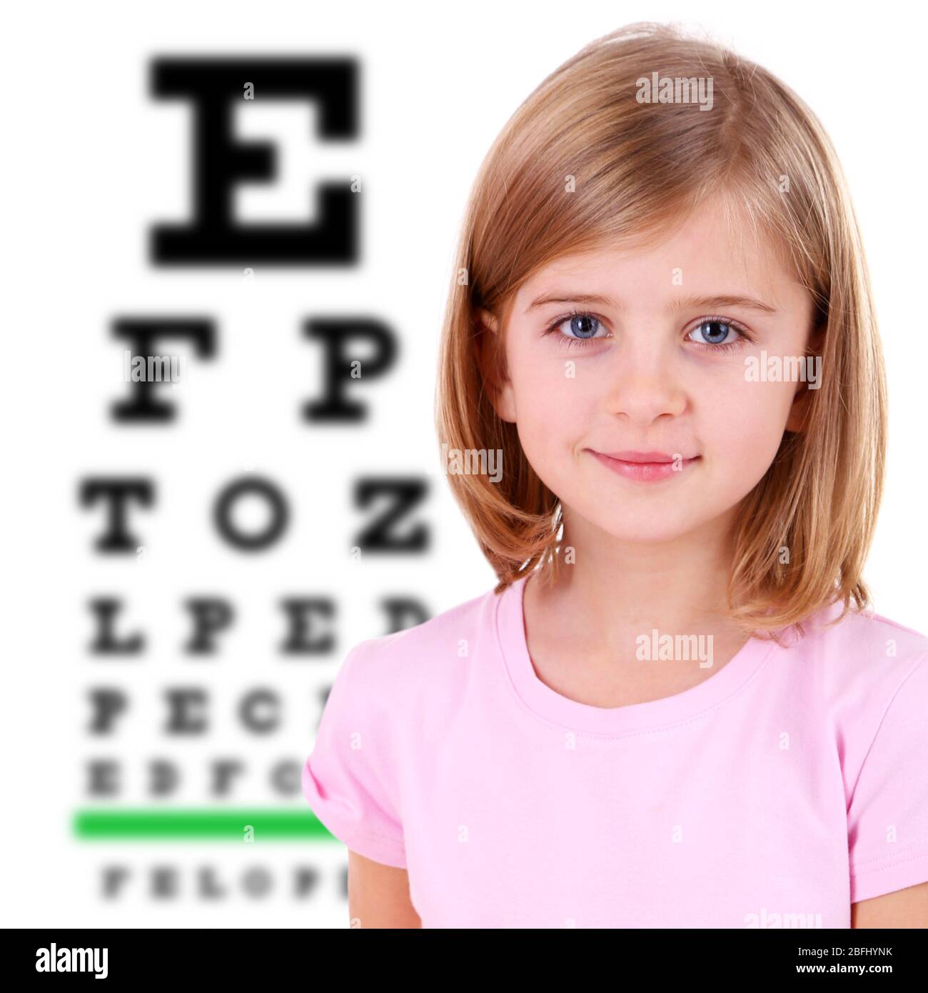 Medicine and vision concept - little girl with eye chart Stock Photo ...