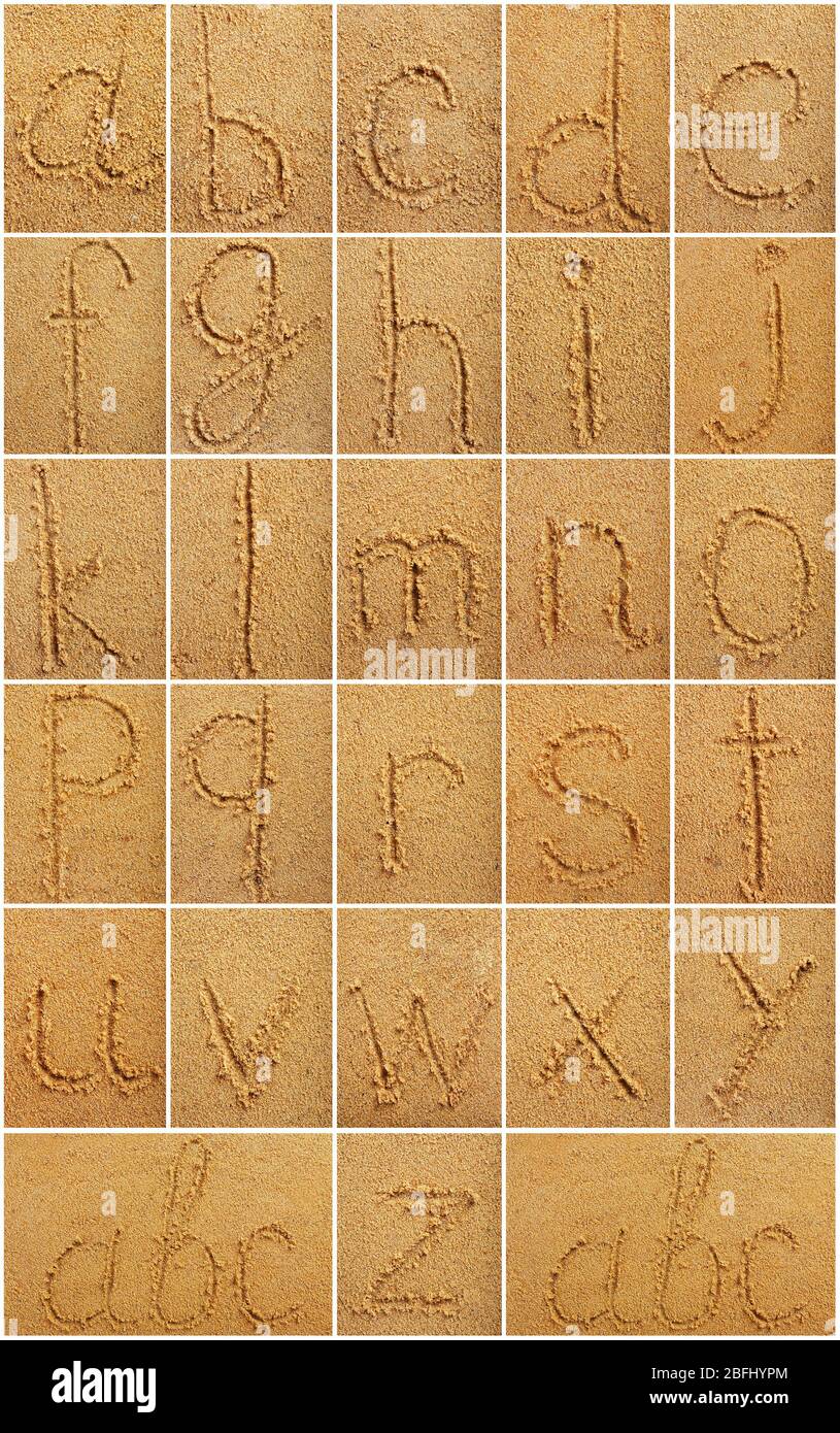 Handwritten alphabet letters on sand background Stock Photo - Alamy