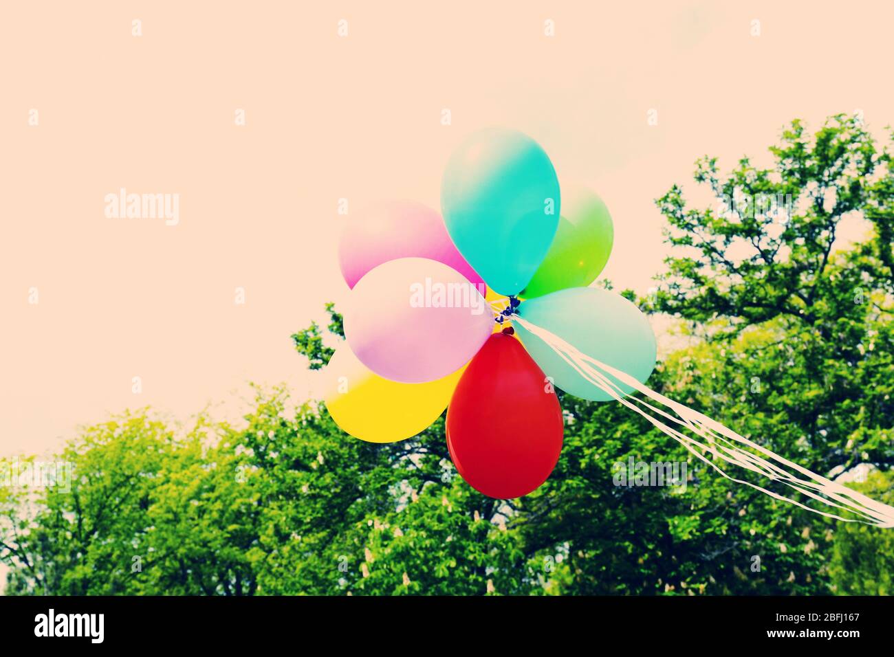 Balloons flying outdoors Stock Photo - Alamy