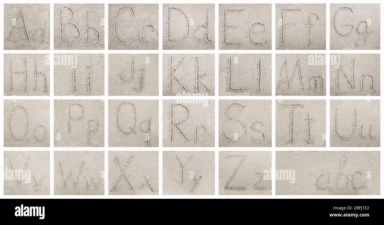 Handwritten alphabet letters on sand background Stock Photo - Alamy