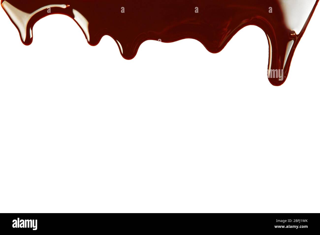 Melted chocolate dripping on white background Stock Photo - Alamy
