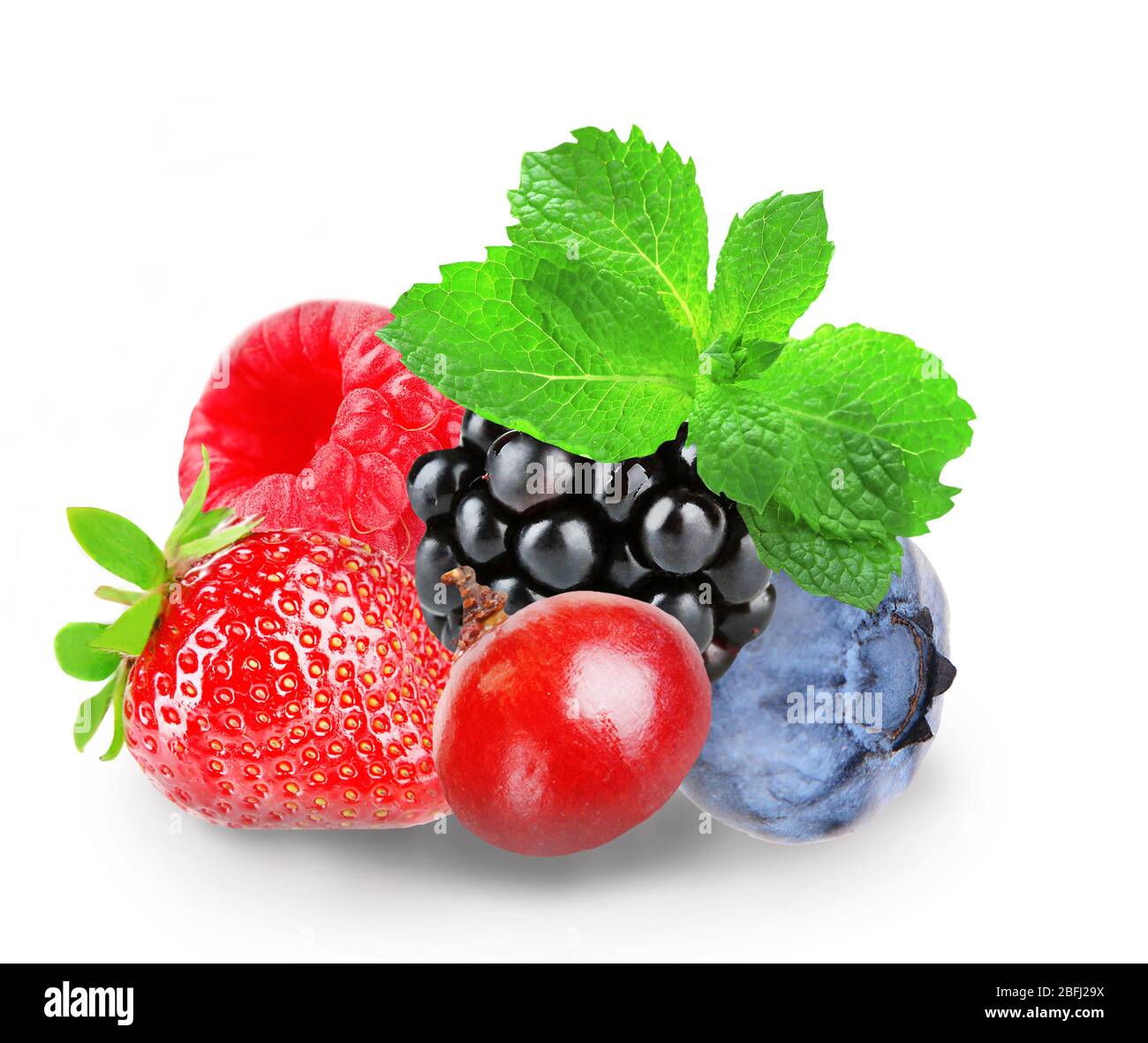 Berries mix with mint isolated on white Stock Photo - Alamy