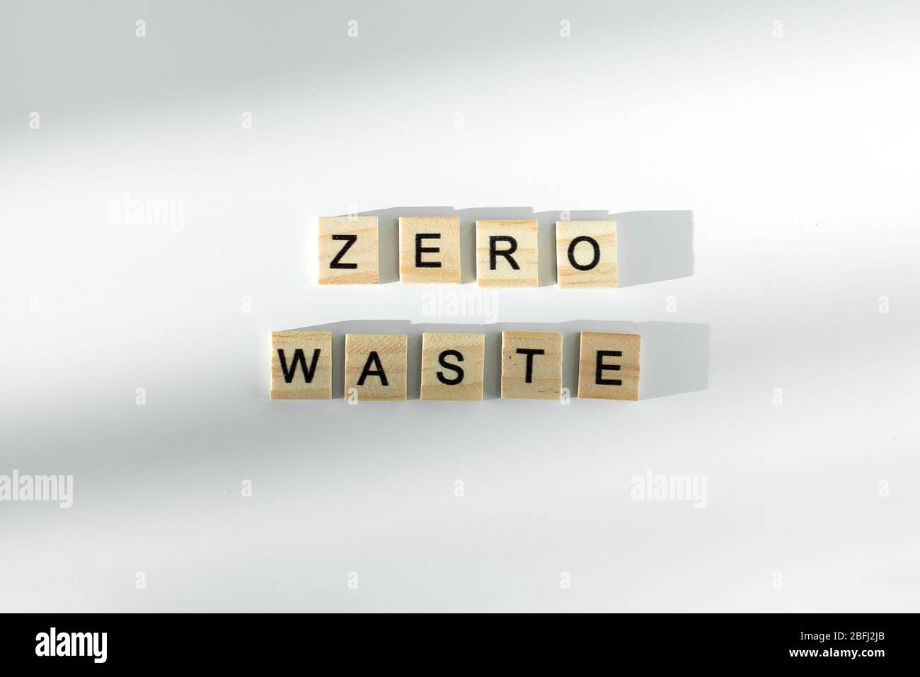 Zero waste text written by wooden letters on white background. Flat lay ...