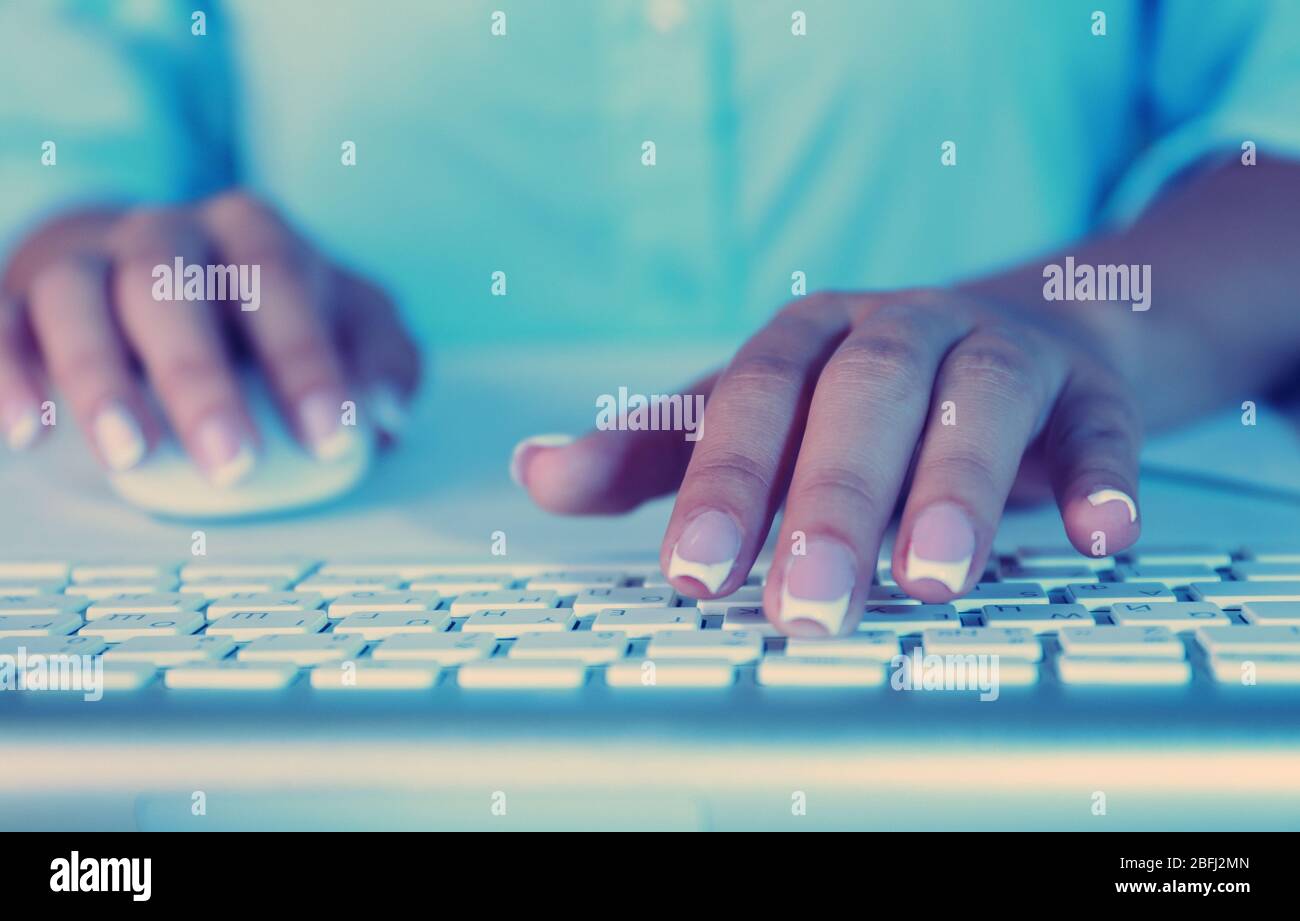 Female hand holding computer mouse, close-up Stock Photo - Alamy