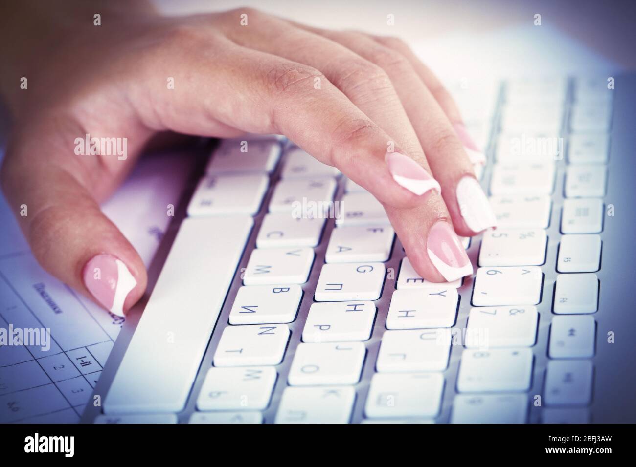 Female hands typing on keyboard, close-up Stock Photo - Alamy