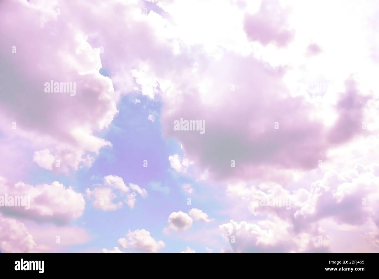 Blue sky background with pink clouds Stock Photo - Alamy