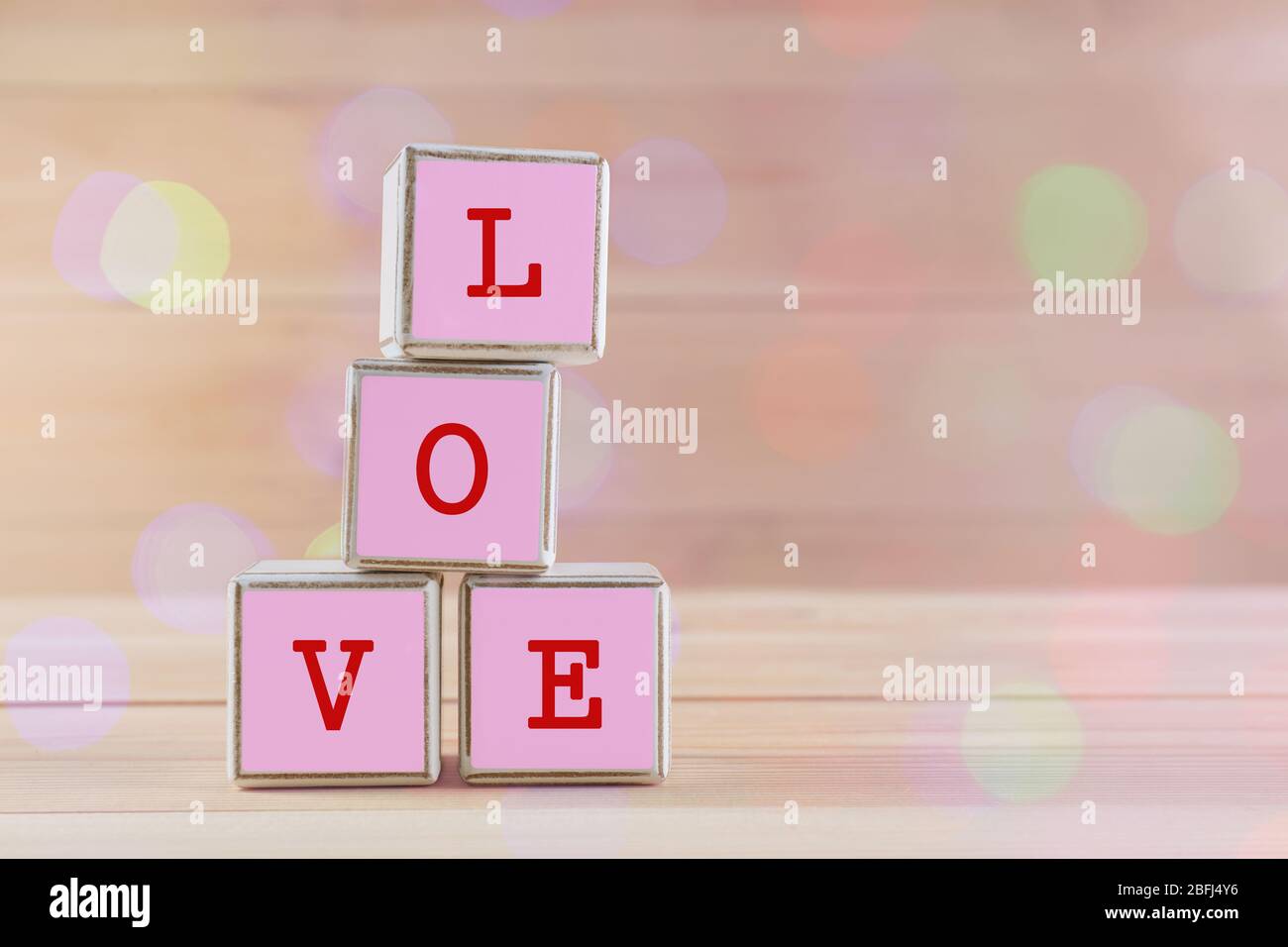 Love spelled in wooden blocks Stock Photo - Alamy