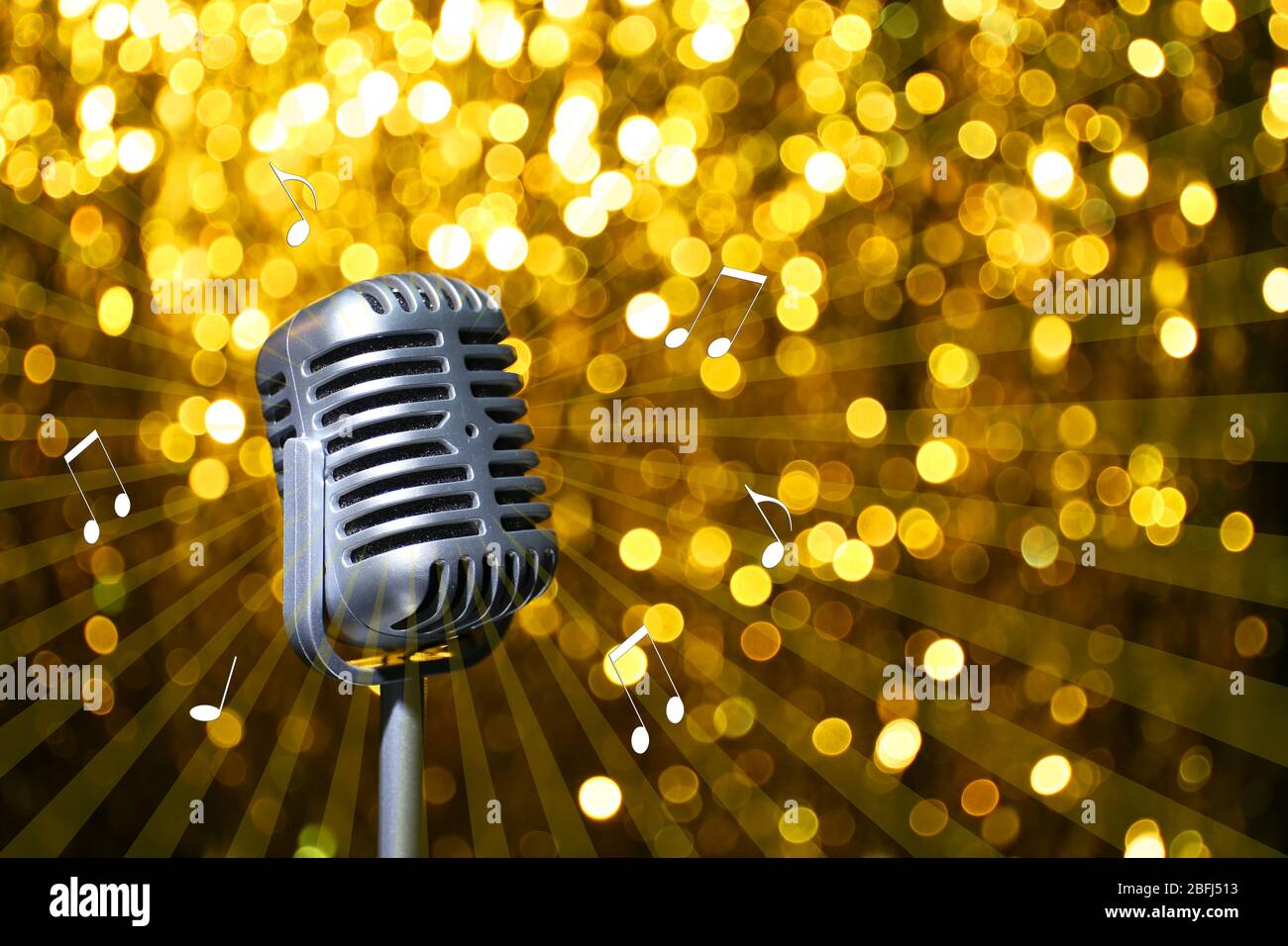 Silver retro microphone on golden festive background, Karaoke party ...