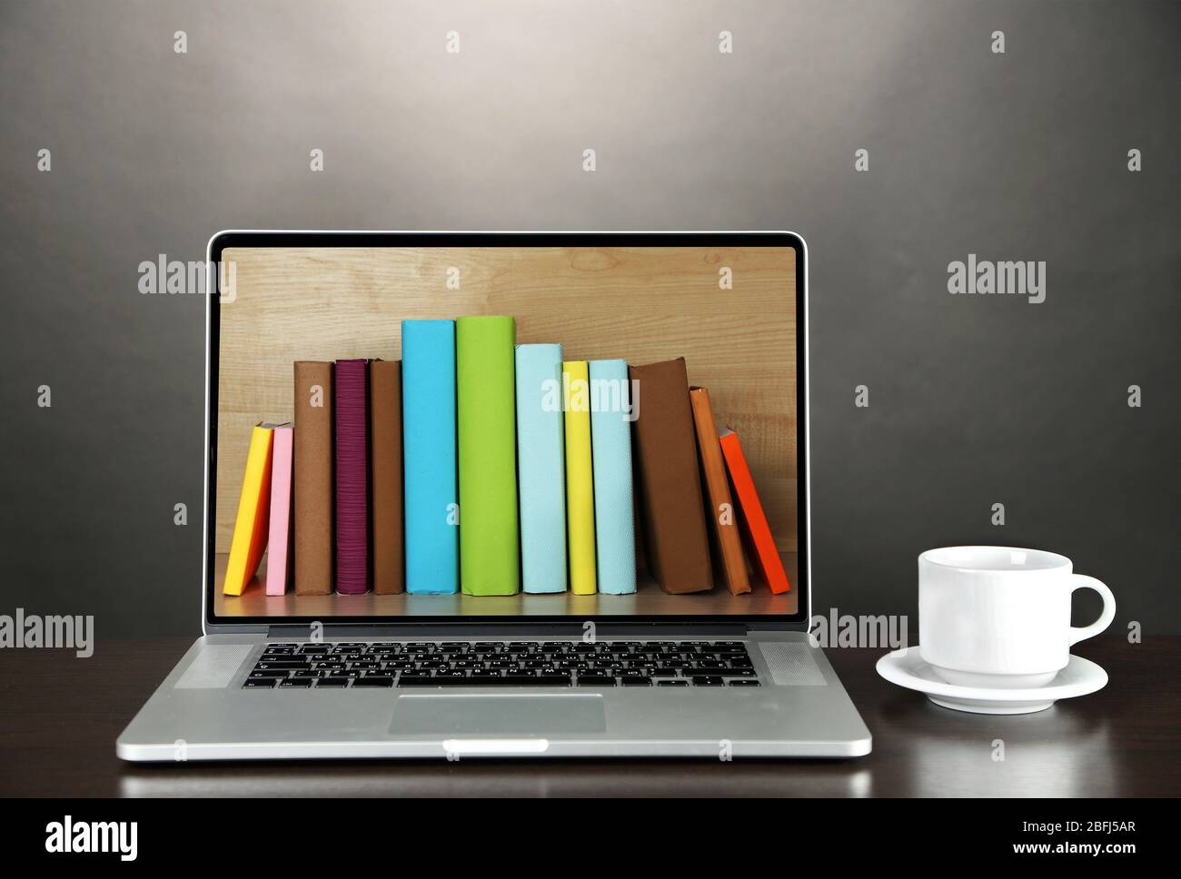 E-learning concept. Digital library - books inside laptop Stock Photo ...