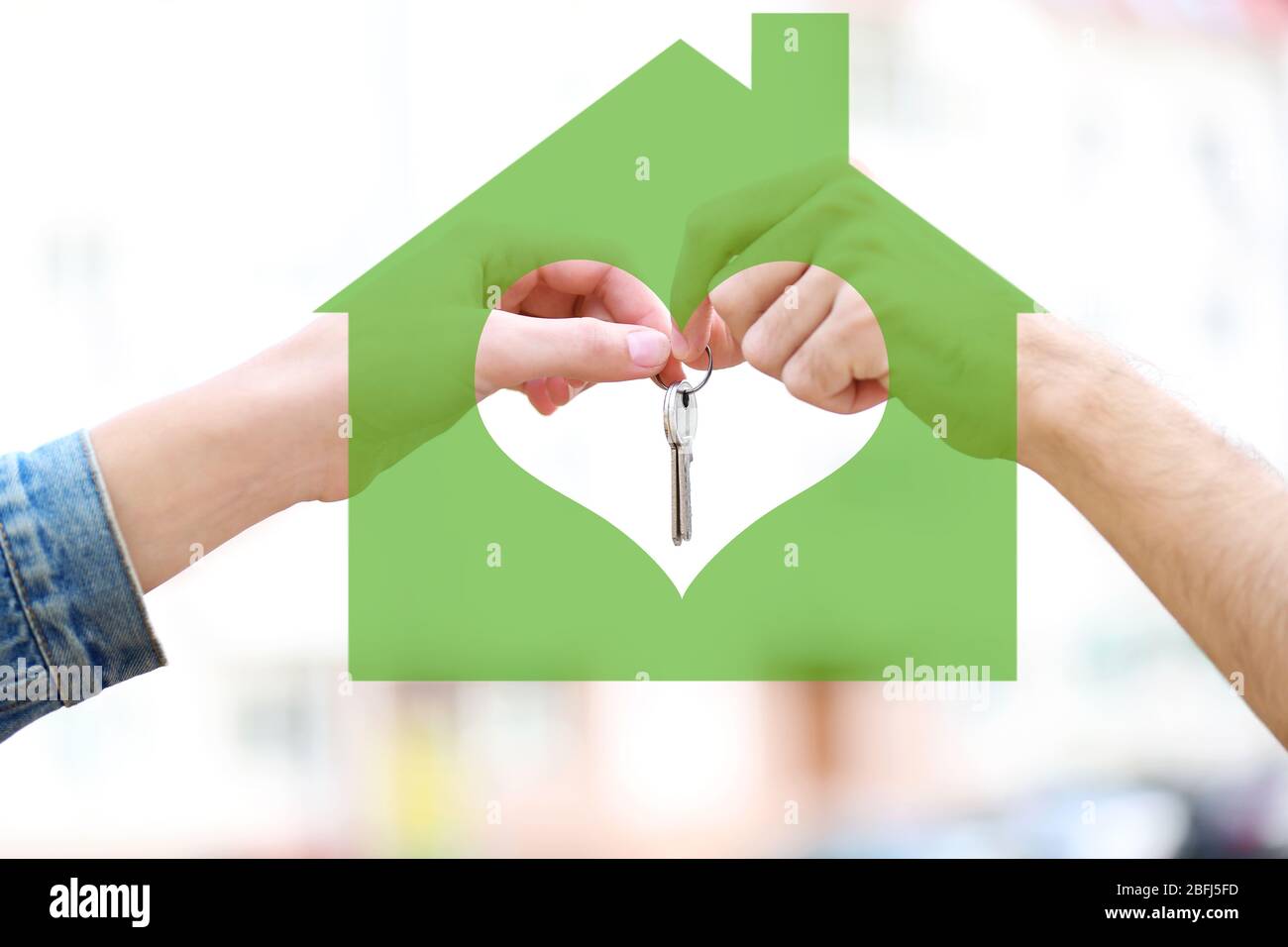 Hands with keys in drawing house Stock Photo - Alamy