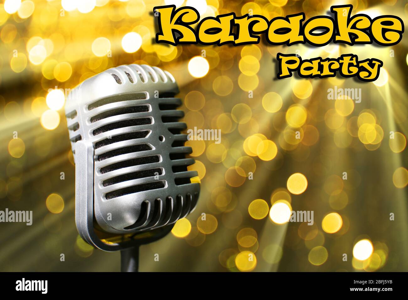 Silver retro microphone on golden festive background, Karaoke party ...