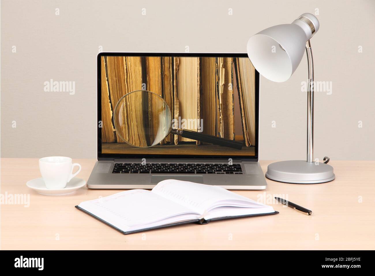 E-learning concept. Digital library - books inside laptop Stock Photo ...