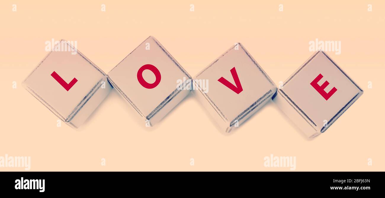 Love spelled in wooden blocks Stock Photo - Alamy