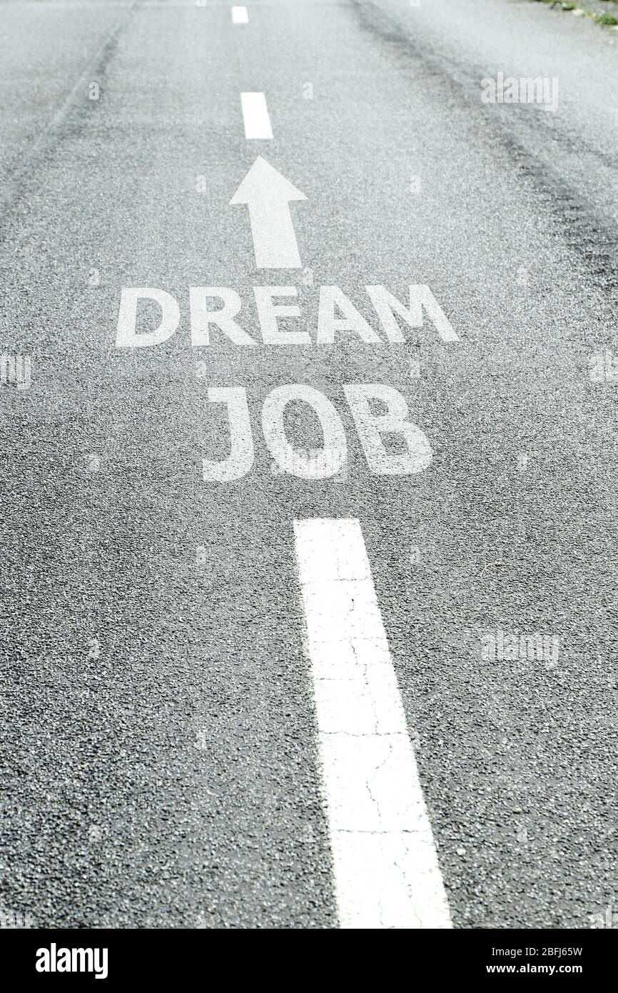Text Dream Job with arrow marking on road surface Stock Photo - Alamy