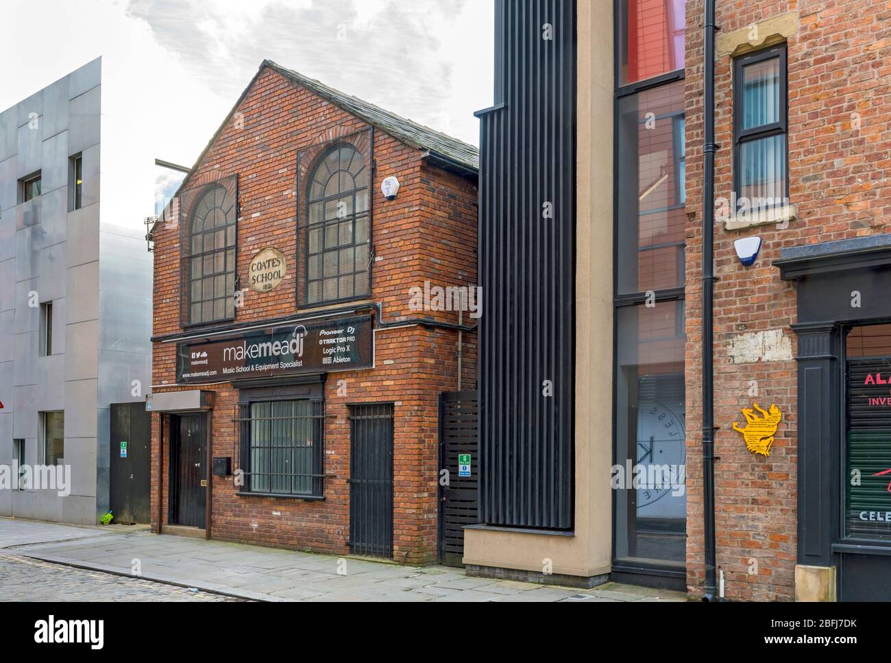 The Coates School building (1821) and the modern stair-core extension ...