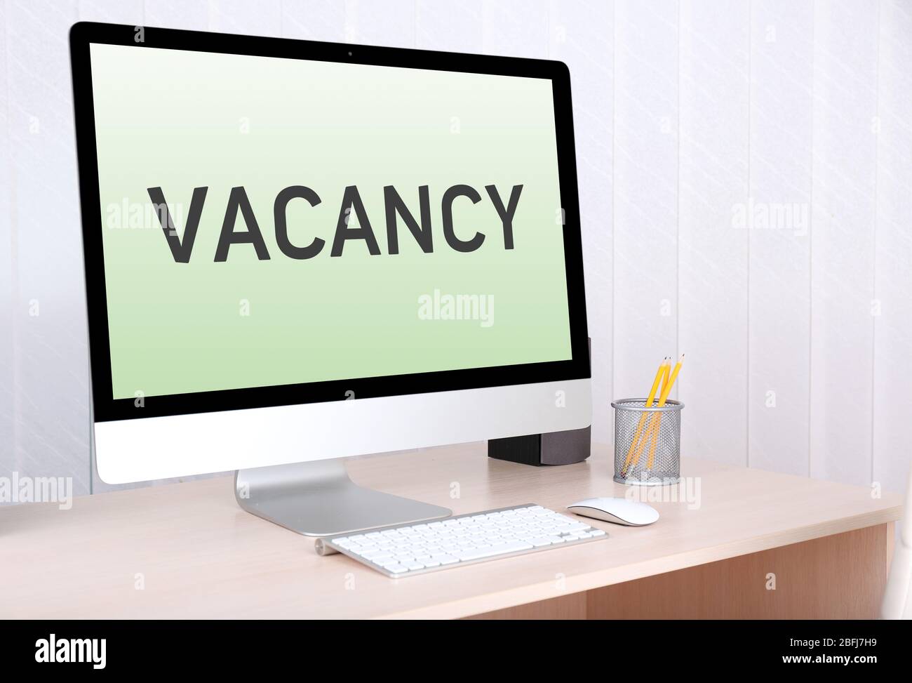 Office workplace with vacancy sign Stock Photo - Alamy