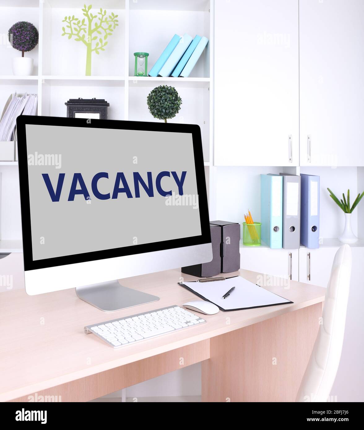Office workplace with vacancy sign Stock Photo - Alamy