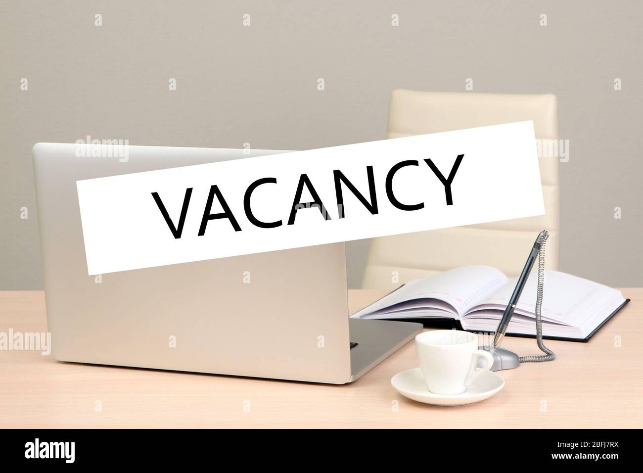 Office workplace with vacancy sign Stock Photo - Alamy