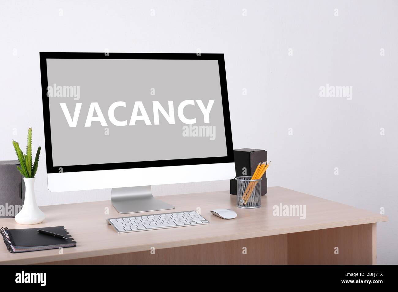Office workplace with vacancy sign Stock Photo - Alamy