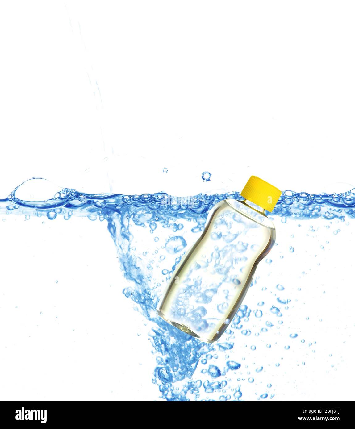 Bottle of baby oil in water, isolated on white Stock Photo - Alamy