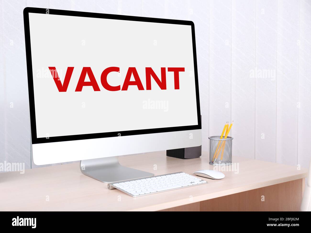 Office workplace with vacant sign Stock Photo - Alamy