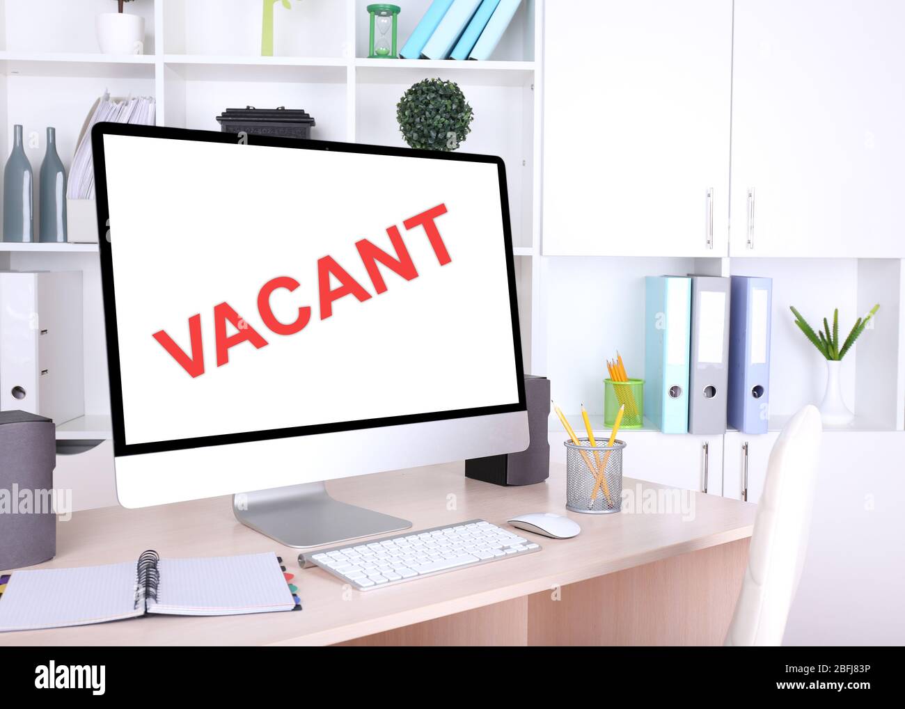 Office workplace with vacant sign Stock Photo - Alamy