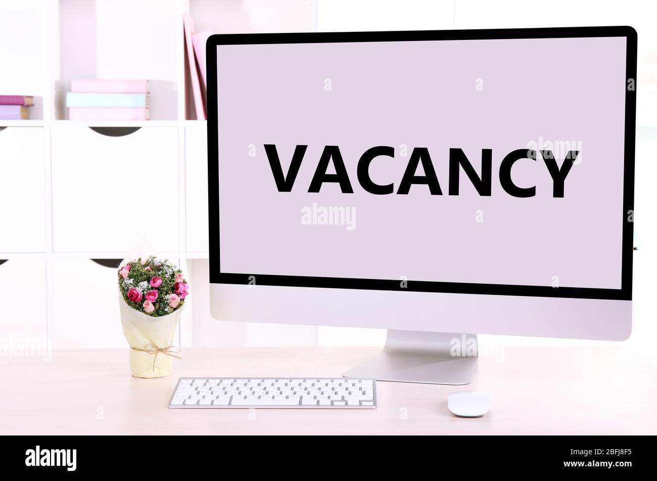 Office workplace with vacancy sign Stock Photo - Alamy