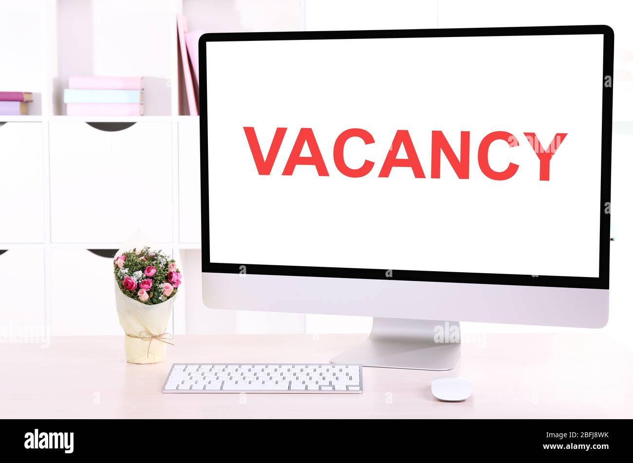 Office workplace with vacancy sign Stock Photo - Alamy