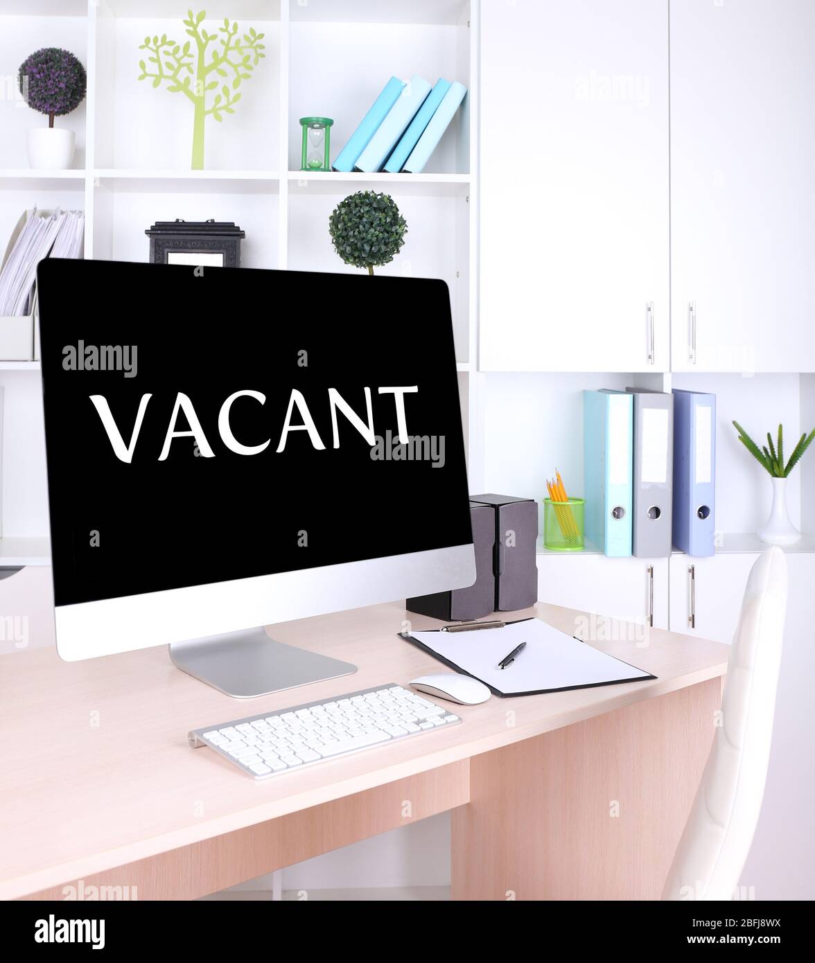Office workplace with vacant sign Stock Photo - Alamy