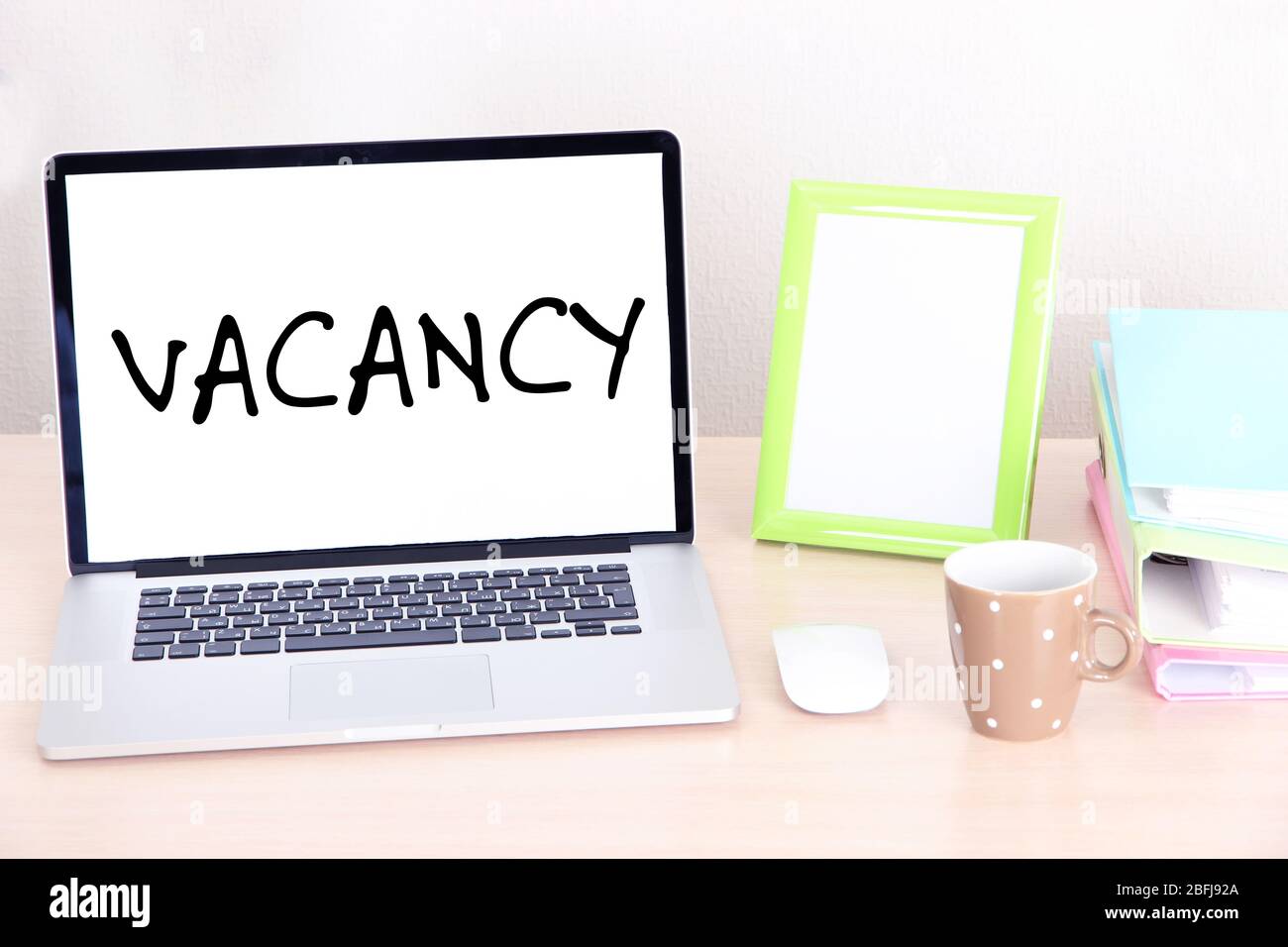 Office workplace with vacancy sign Stock Photo - Alamy
