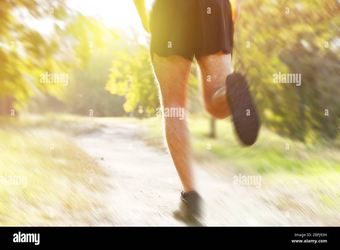 Runner feet on road, outdoors Stock Photo - Alamy