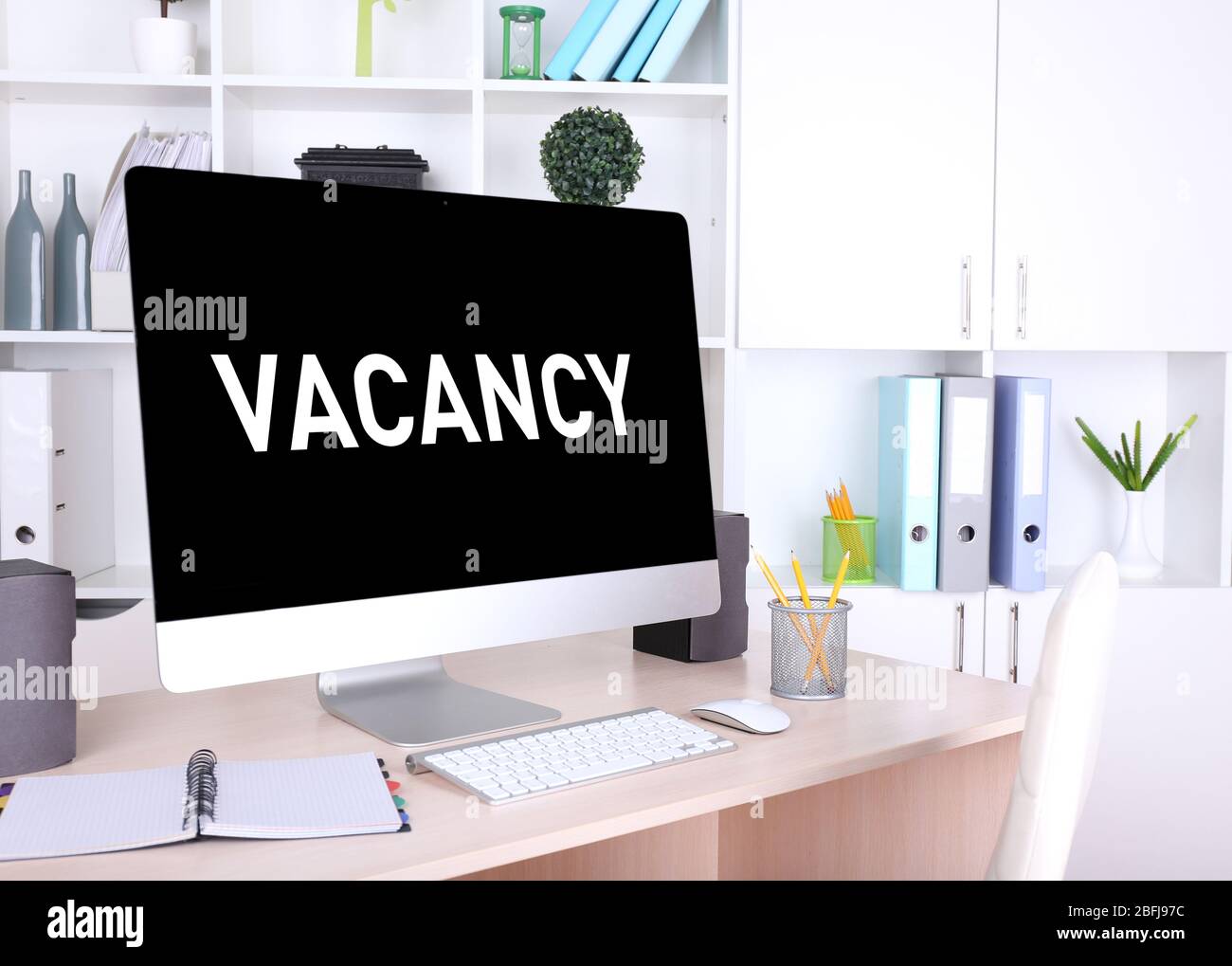 Office workplace with vacancy sign Stock Photo - Alamy