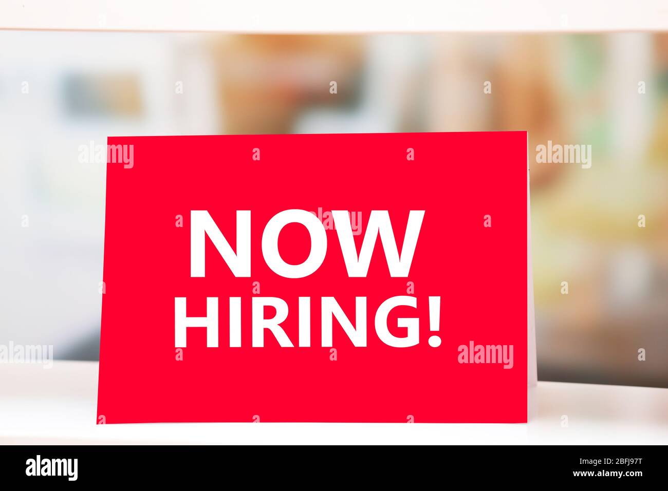 Blank with text Now hiring on bright background Stock Photo - Alamy