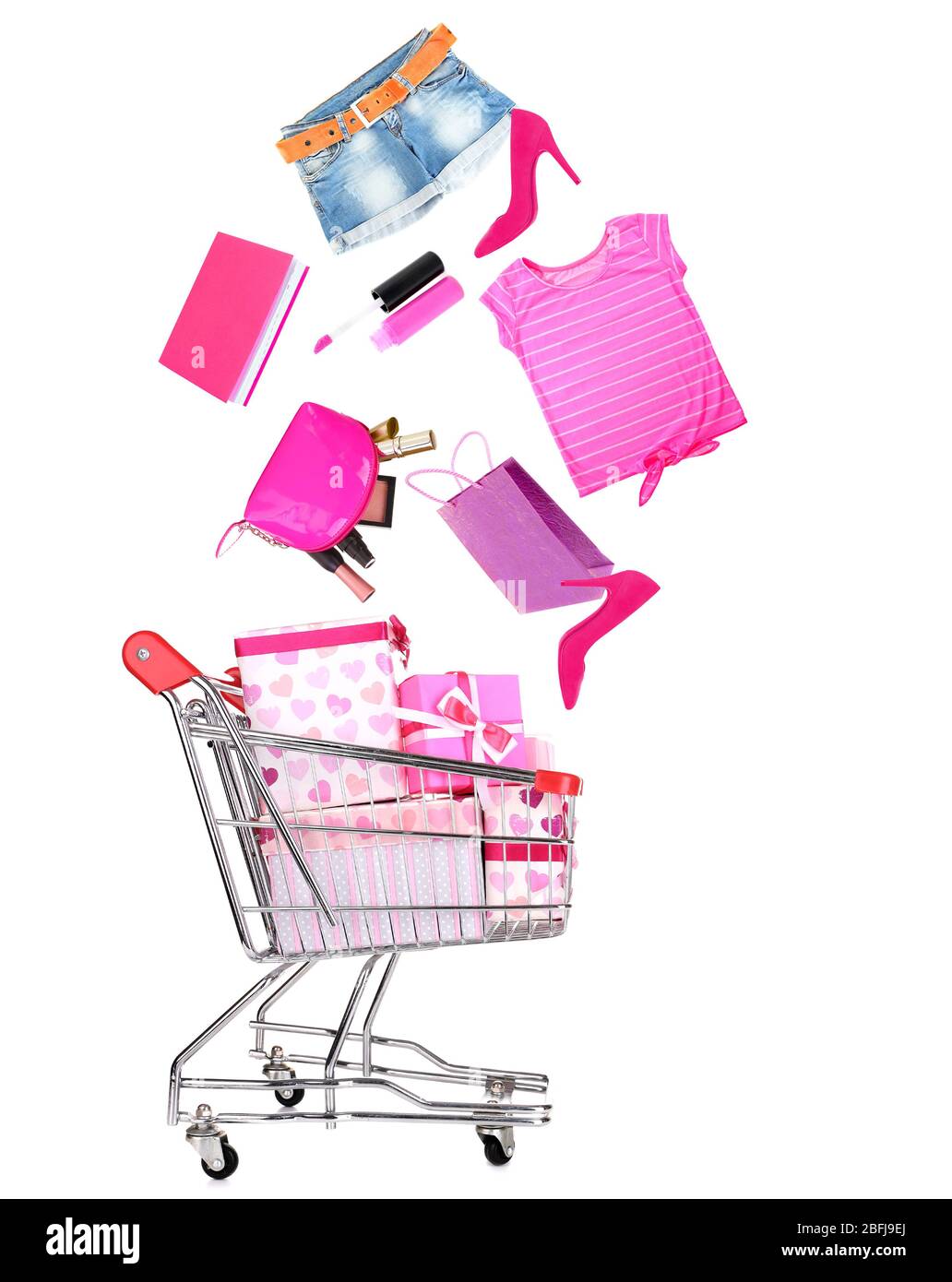 Goods falling into cart isolated on white Stock Photo - Alamy