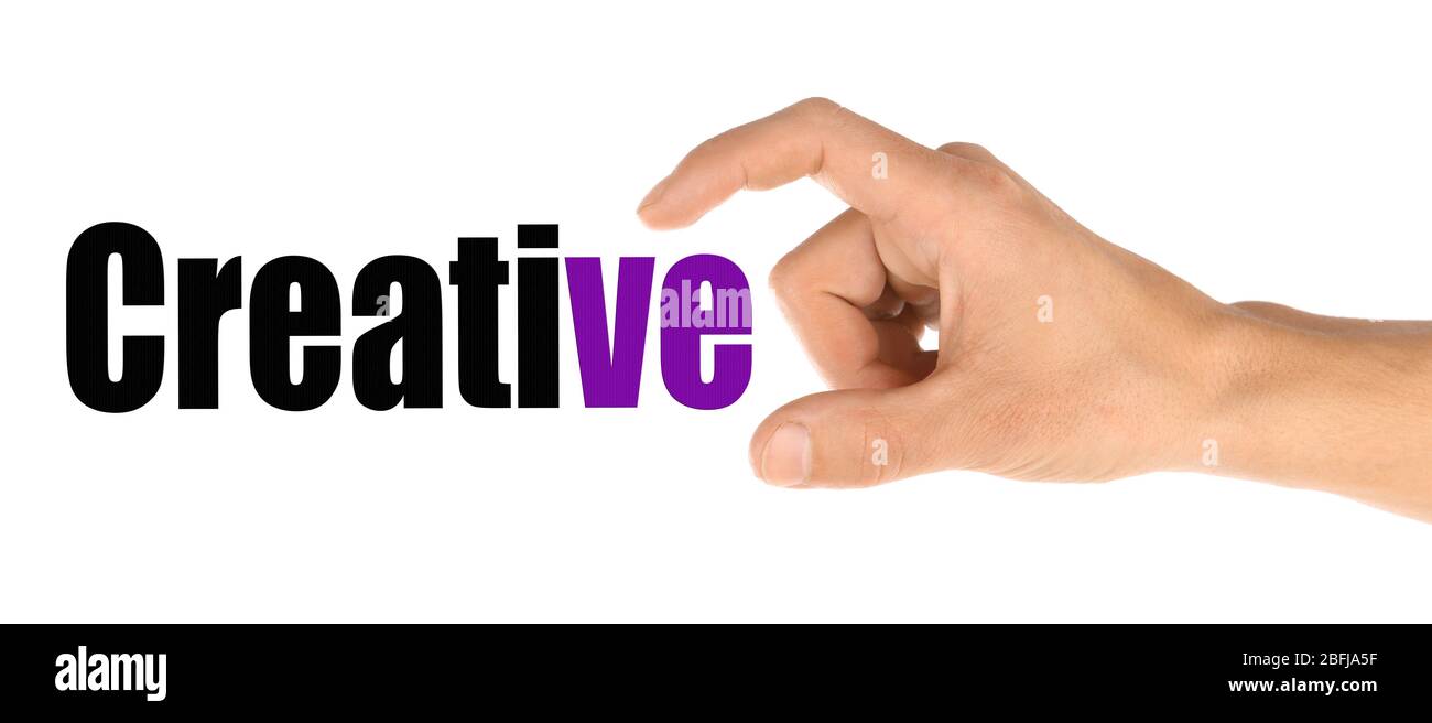 Hand with word Creative isolated on white Stock Photo - Alamy