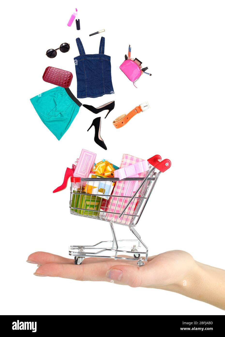 Goods falling into cart isolated on white Stock Photo - Alamy