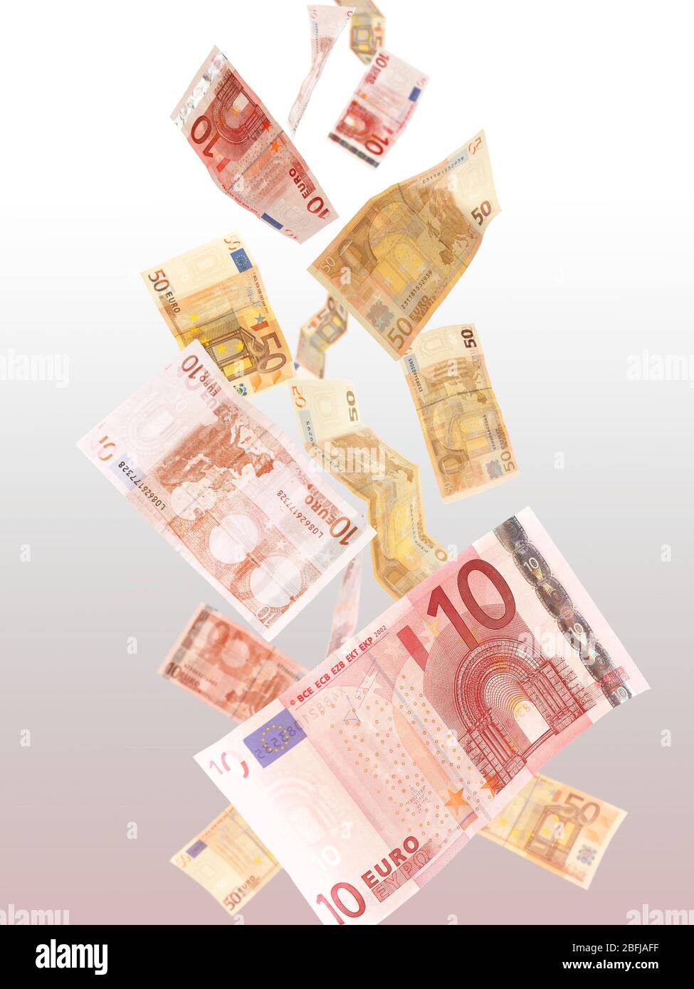 Flying Euro banknotes on light background Stock Photo - Alamy