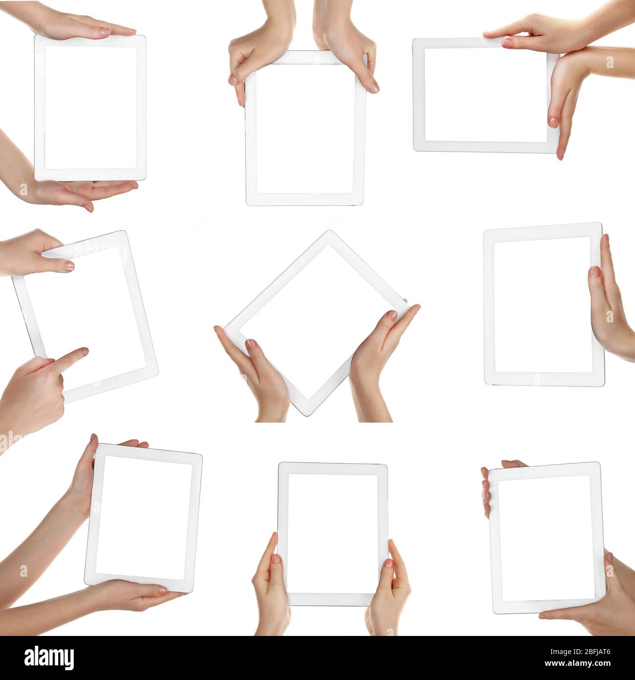 Hands holding tablets isolated on white Stock Photo - Alamy