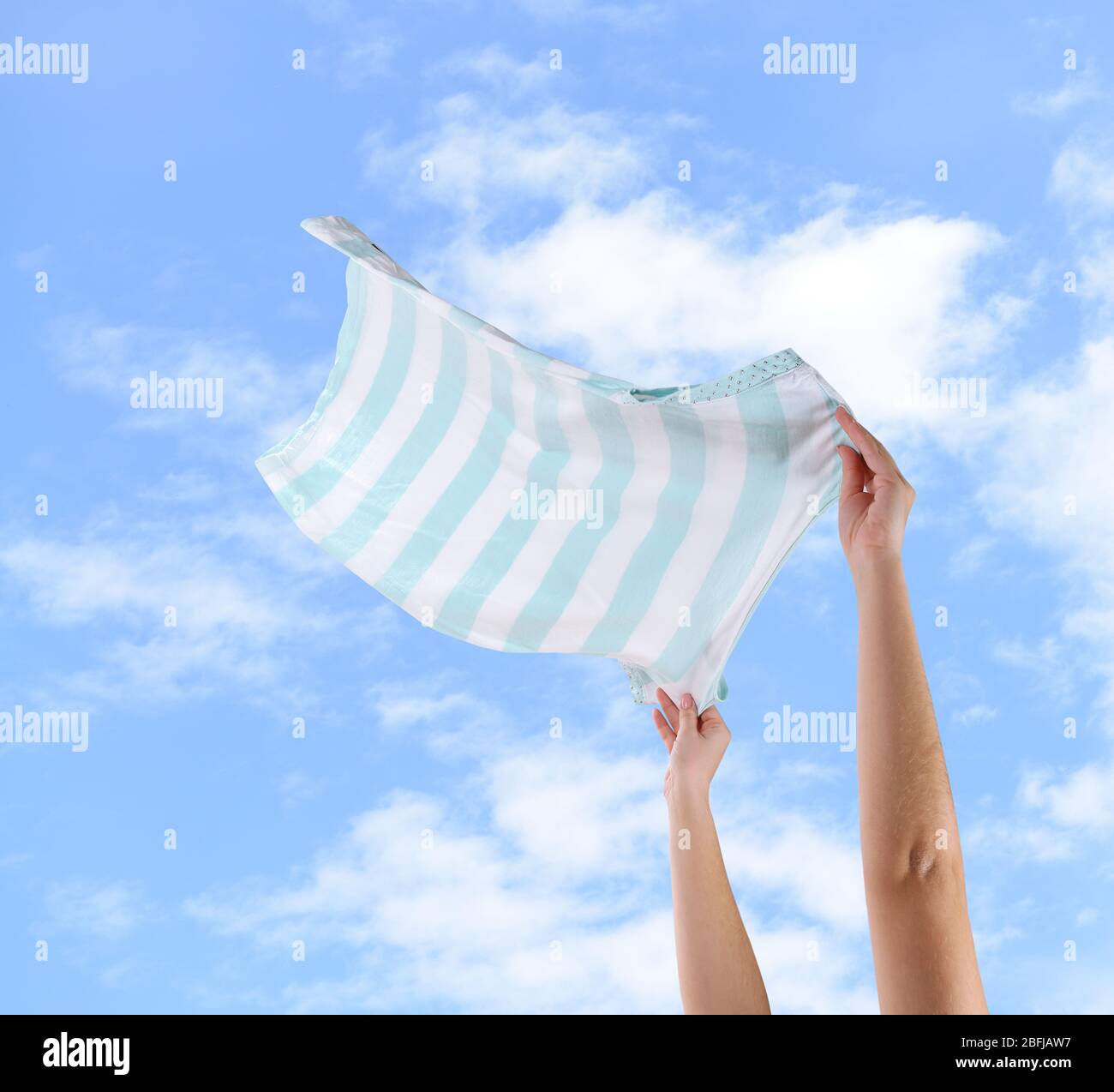 Drying hands on shirt hi-res stock photography and images - Alamy