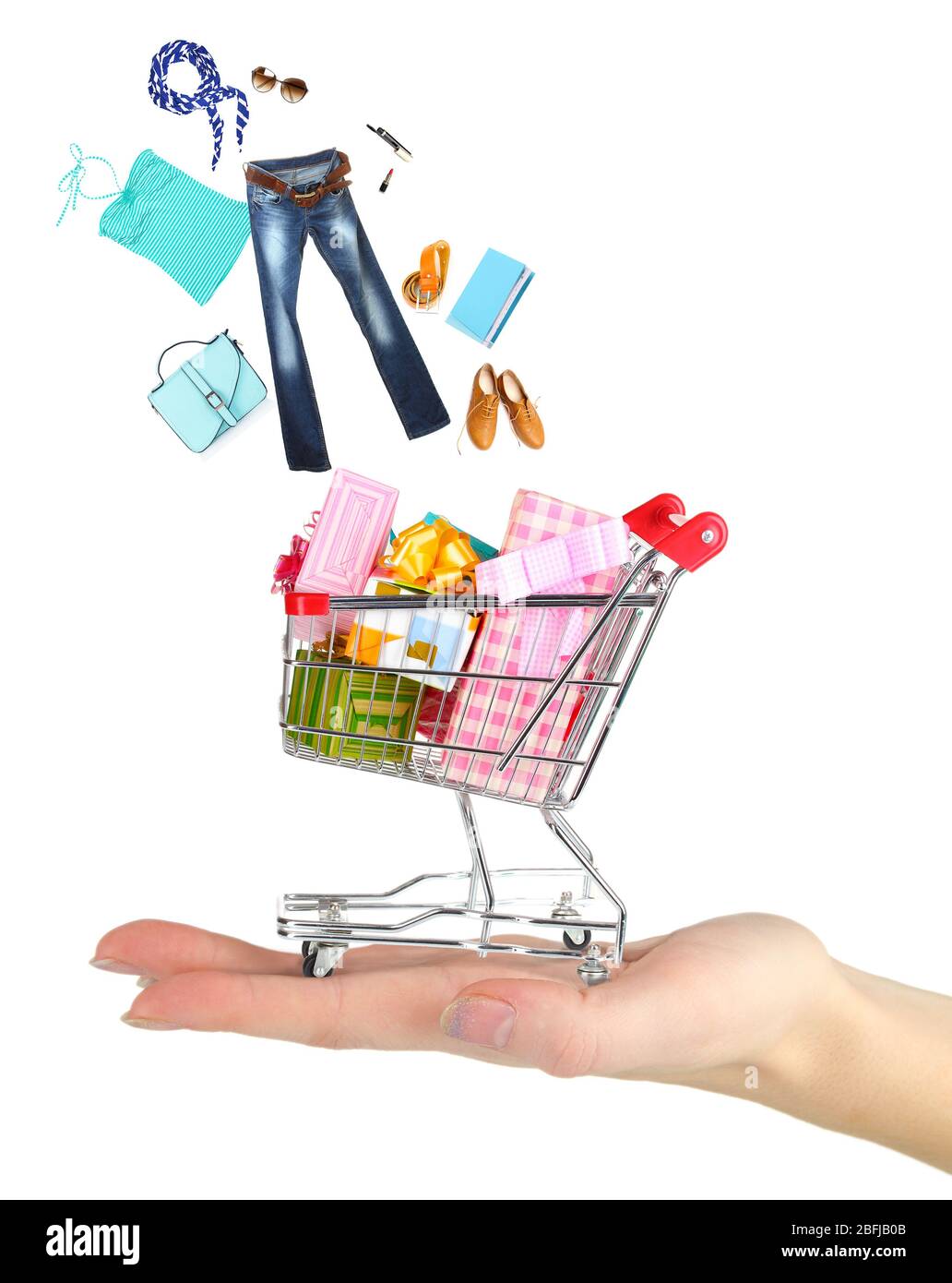 Goods falling into cart isolated on white Stock Photo - Alamy