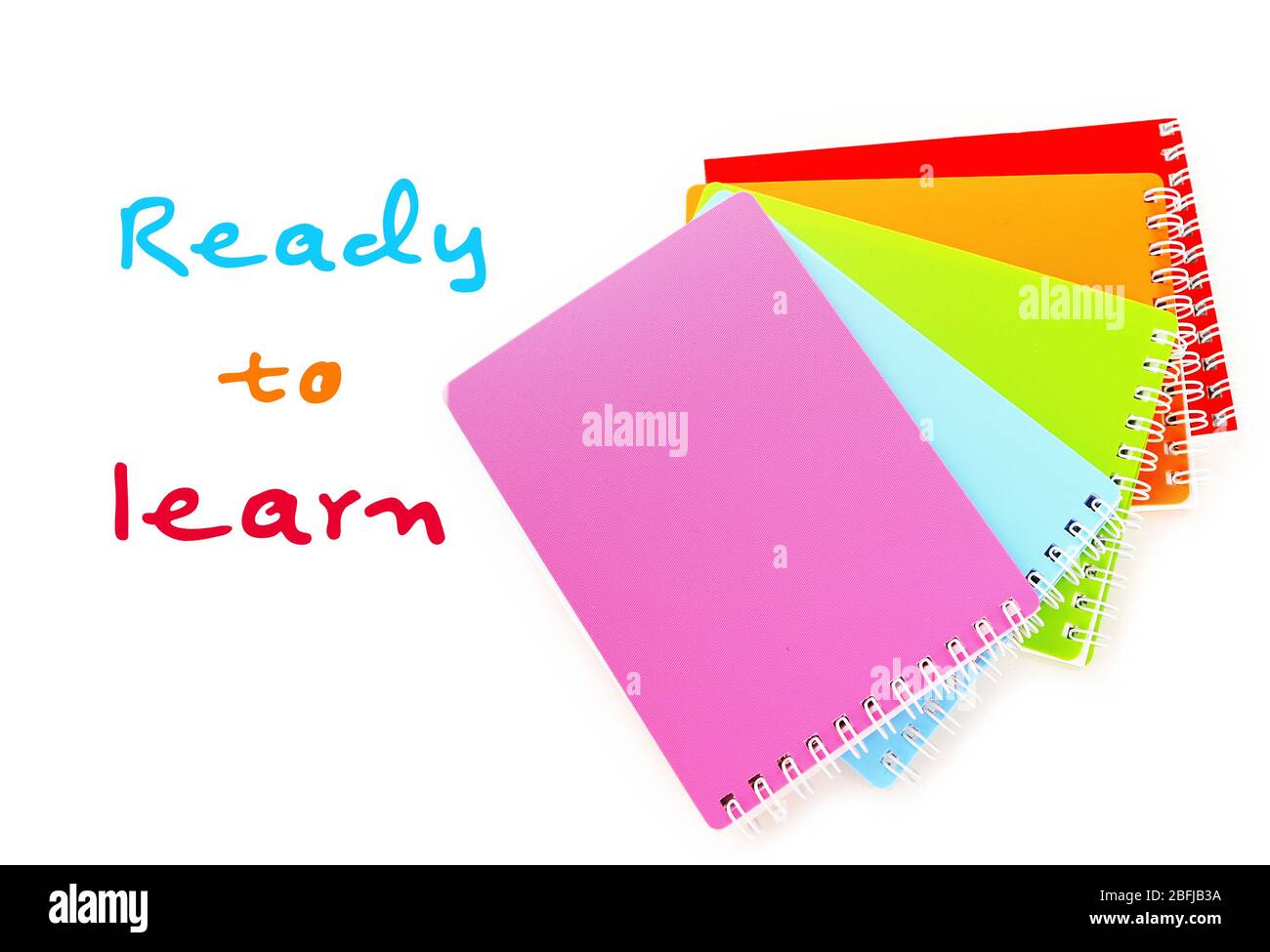 Colorful notebooks, isolated on white Stock Photo - Alamy